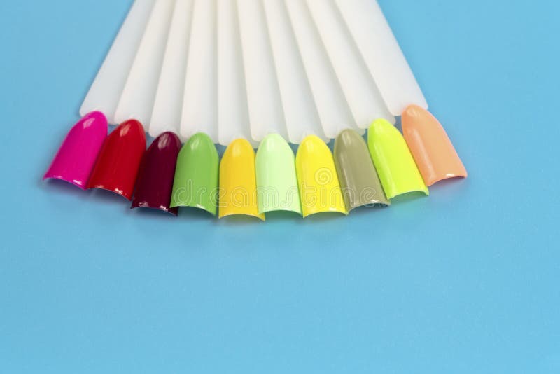 MultiÑ olor Nail Tips on a Blue Background. Examples of Manicure for ...