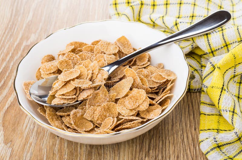 Multi Cereal Flakes and Spoon in Bowl, Napkin, on Table Stock Photo ...