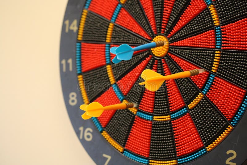 Darts stuck in a board stock photo. Image of leisure - 48973348 Darts stuck in a board stock photo. Image of leisure - 48973348