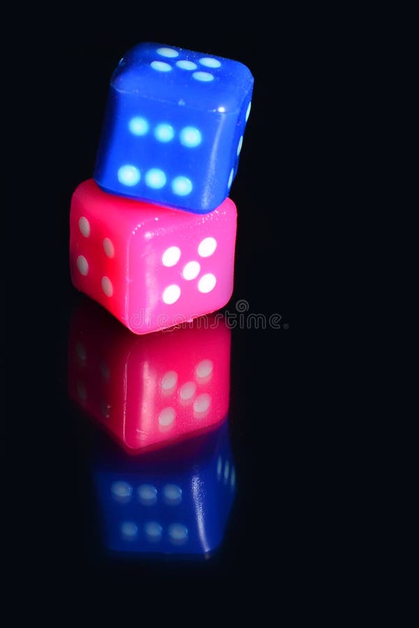 Multi Color Dice Placed on Top of Each Other Over Reflecting Surface ...