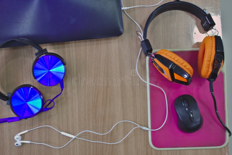 Three Headphones on the Desk. Portable Computers and Controls Stock ...