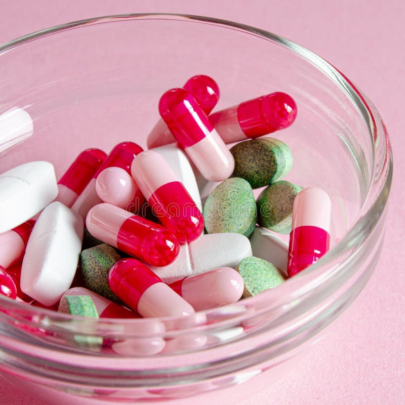 Multi-colored Anti-virus Tablets of Different Shapes Lie in a Glass ...