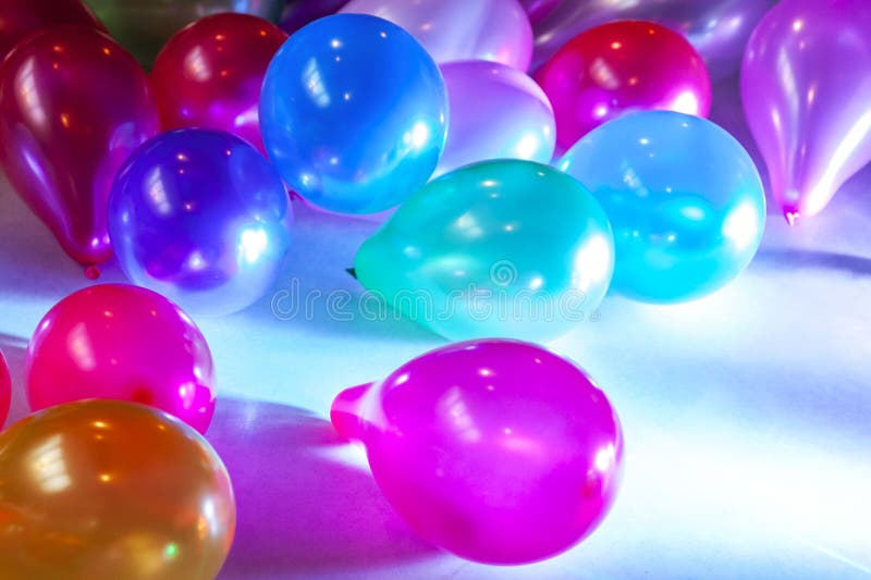 Multi-colored Balloons on the Floor in the Light of Spotlights. Events ...