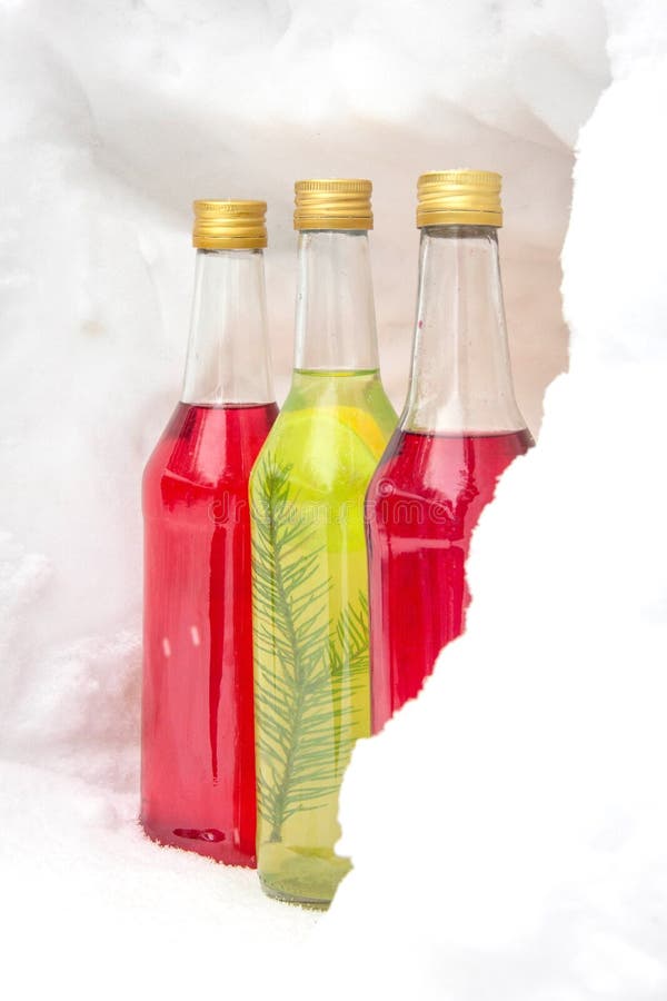 Bottles with Alcohol in the Snow.Multi-colored Bottles Stock Photo ...