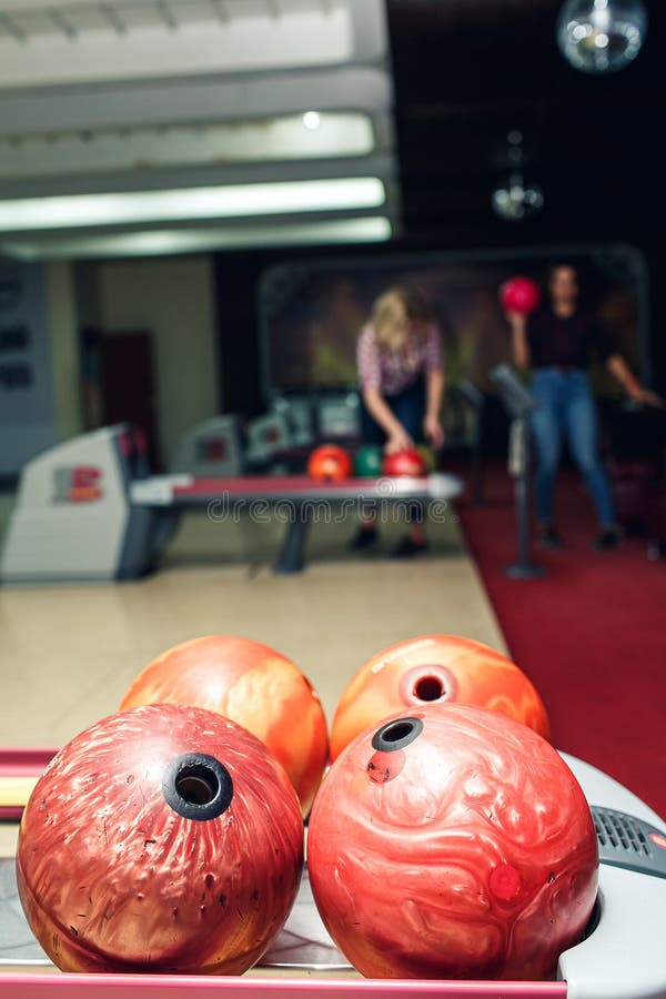 Multi-colored Bowling Balls Lie on Shelf in Bowling Club Stock Image ...