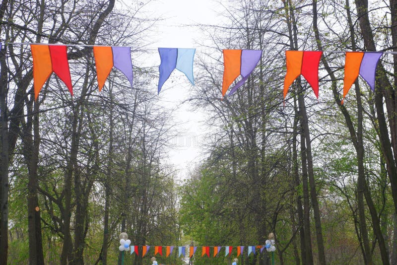 Multi-colored Bright Flags in Front of the Entrance To the Park. Stock ...