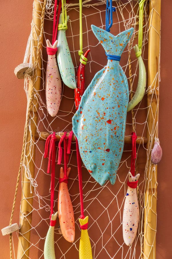 Multi-colored Ceramic Fish in Decorative Nets Stock Photo - Image of ...