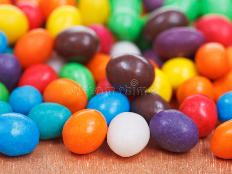 Multi-colored Chocolate Candy Dragees Stock Photo - Image of form, wood ...