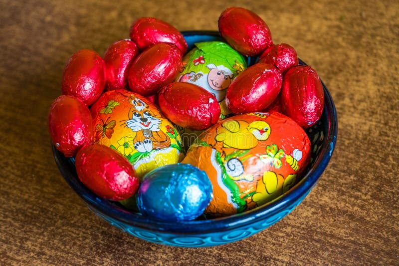 Multi-colored Chocolate Eggs in a Blue Bowl, Seasoned for the Feast of ...