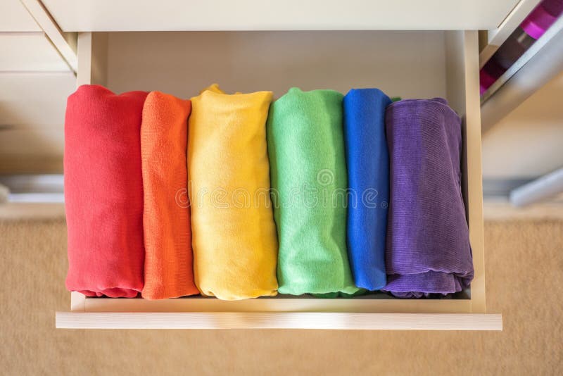 Multi-colored Clothes Folded Vertically in a Wardrobe Drawer. the ...