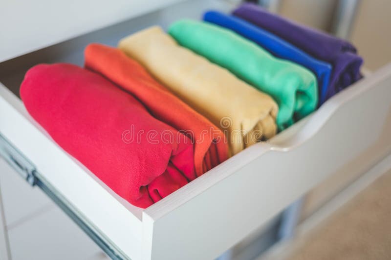 Multi-colored Clothes Folded Vertically in a Wardrobe Drawer. the ...