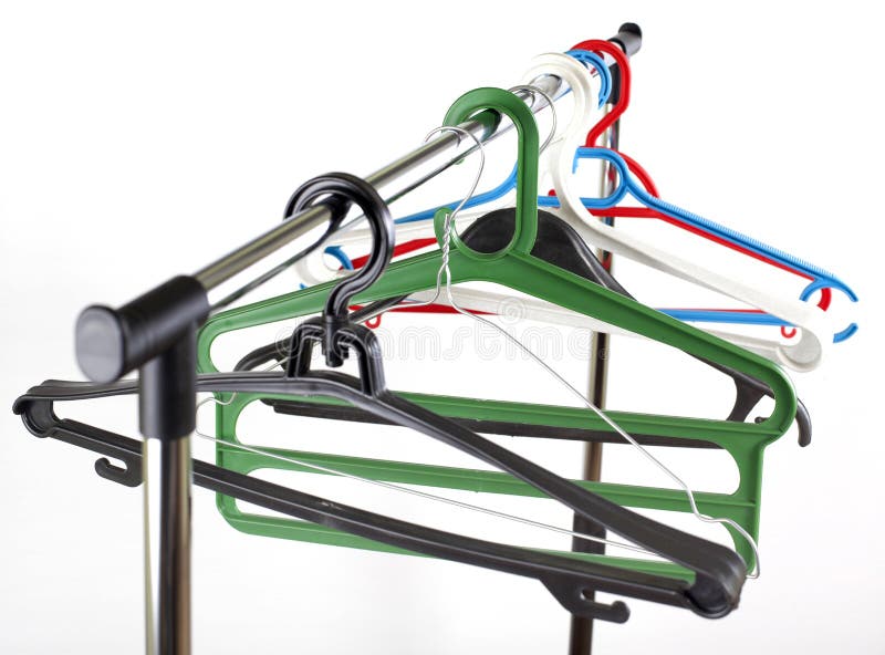 Multi Colored Clothes Hangers on Metal Crossbar Over White. Stock Photo ...