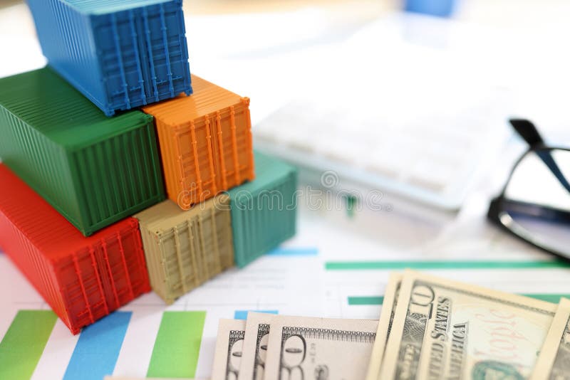 Multi-colored Containers with Goods Near Dollar Banknotes Stock Photo ...