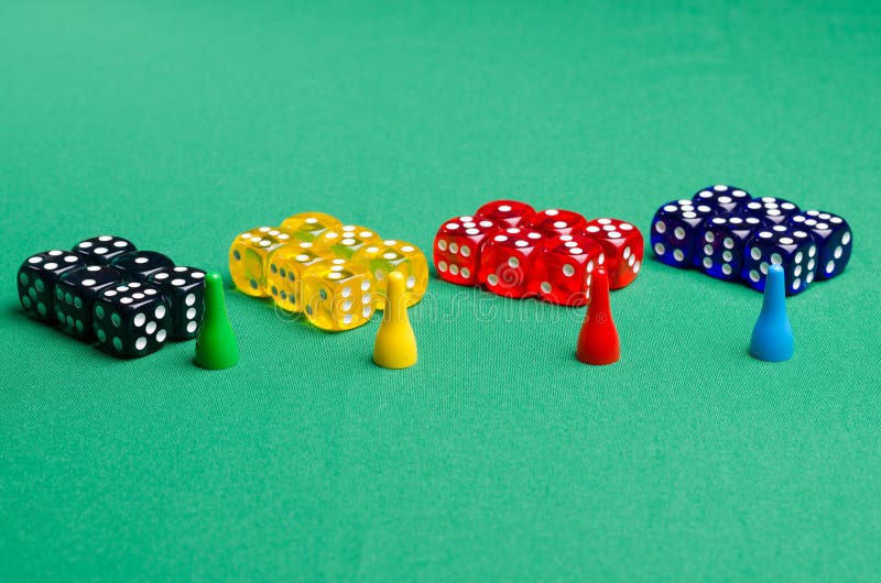 Multi-colored Dice for Table Games on a Green Table Stock Image - Image ...
