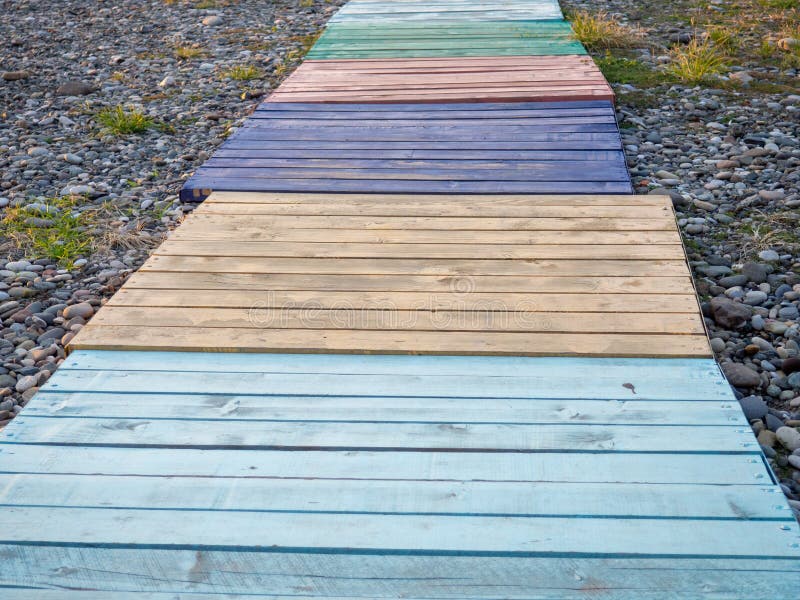 Multi-colored Decking on a Pebble Beach. the Path To the Shore from ...
