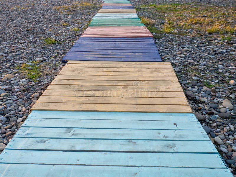 Multi-colored Decking on a Pebble Beach. the Path To the Shore from ...