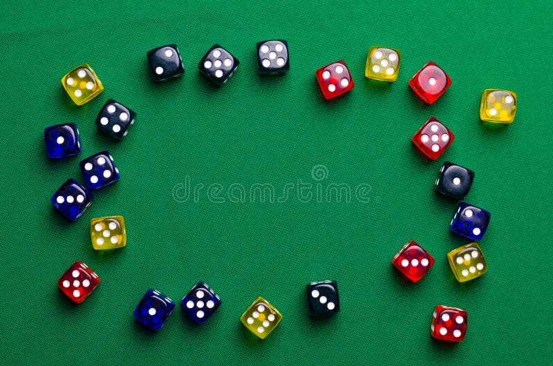 Multi-colored Dice for Table Games on a Green Table Stock Photo - Image ...