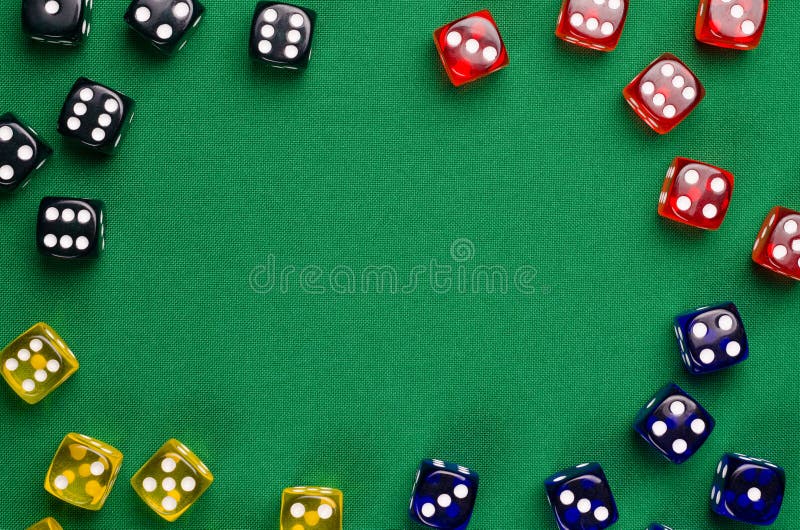 Multi-colored Dice for Table Games on a Green Table Stock Photo - Image ...