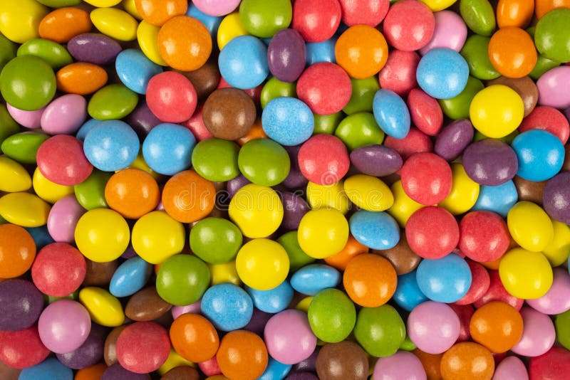 Multi-colored Dragees with Chocolate Filling. Close-up As a Background ...