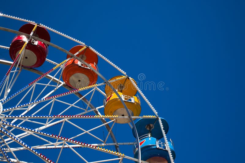 Multi-colored Ferris Wheel Against a Blue Sky Stock Photo - Image of ...