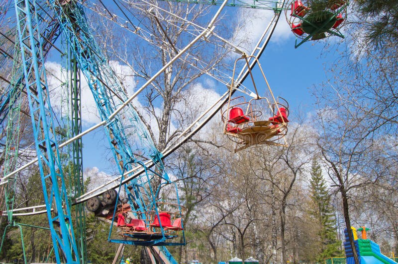 Multi-colored Ferris Wheel in the Spring Park on a Sunny Day, Close-up ...