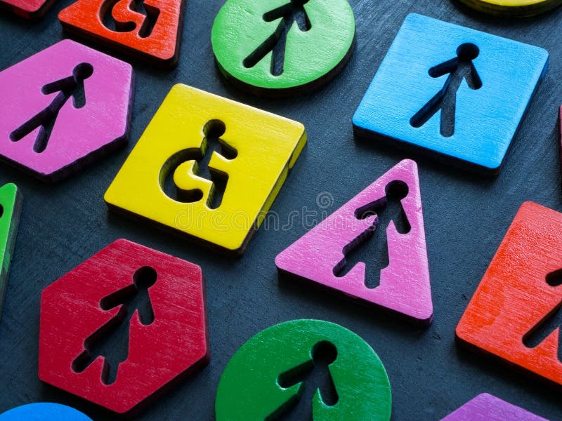 Multi-colored Figures and Disabled Person Sign. Stock Photo - Image of ...