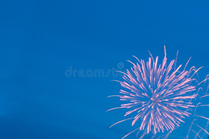 Multi-colored Fireworks Against the Dark Blue Sky in the Right Corner ...