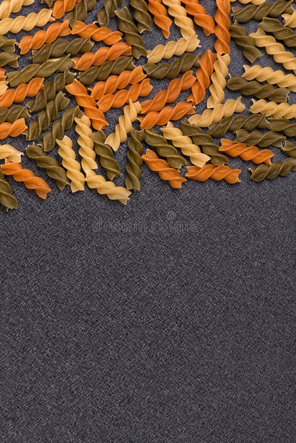 Multi-colored Fusilli on Gray Background. Pasta Background. Copy Space ...