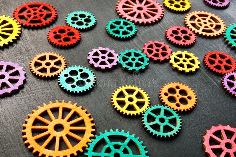 Multi-colored Gear Wheels on a Dark Surface. Variety and Interaction ...