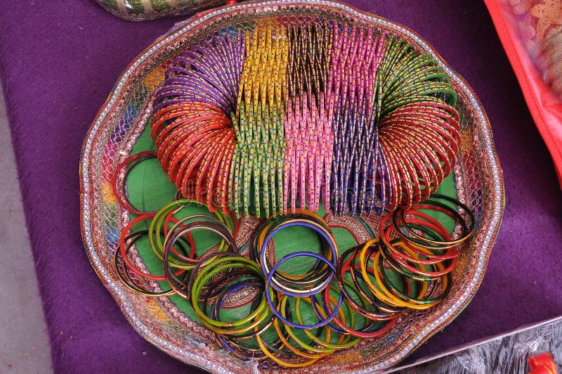 Multi Colored Glass Bangle Arranged in a Pattern on a Plate Stock Photo ...