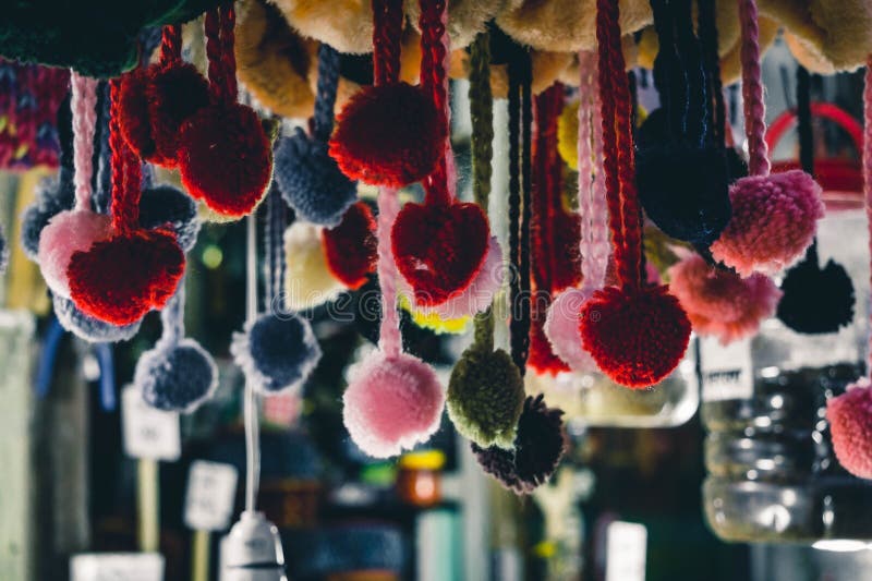 Multi - Colored, Heart Shaped Pom Poms Hanging from Strings Stock Photo ...