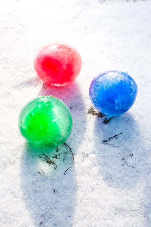 Multi-colored Ice Balls in the Snow on a Sunny Day, Top View Stock ...