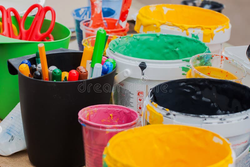 On the Table are Markers, Paper Clips and a Notebook with the ...