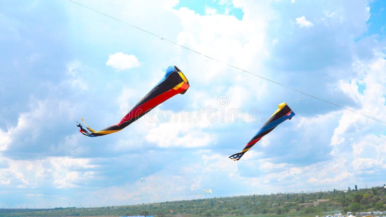 Multi-colored Kites Flying Against the Blue Sky and Clouds Stock Image ...