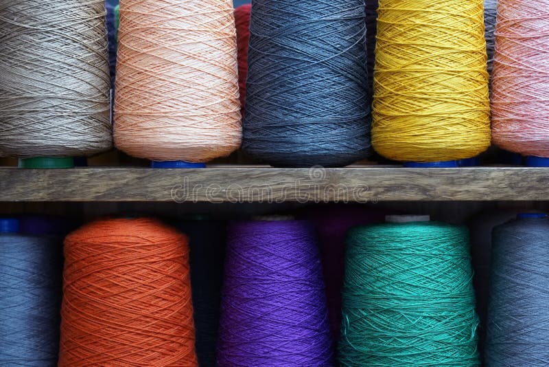 Multi-colored Large Spools of Thread in a Row. Spools of Colored Thread ...