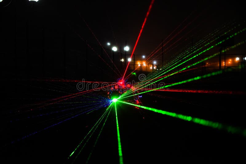 Multi-colored Laser Beams. Man Laserboy Stock Image - Image of ...
