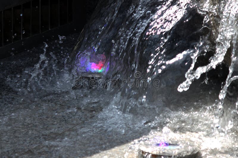 Multi-colored Lighting on the Fountain through the Flow and Splashes ...