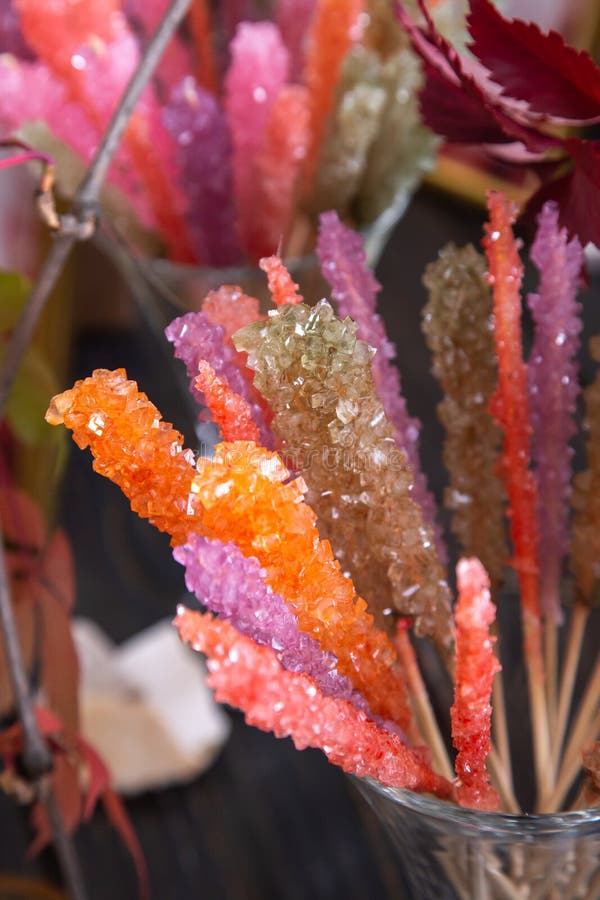 Multi-colored Lollipops with Large Crystals of Sugar on Sticks in Glass ...