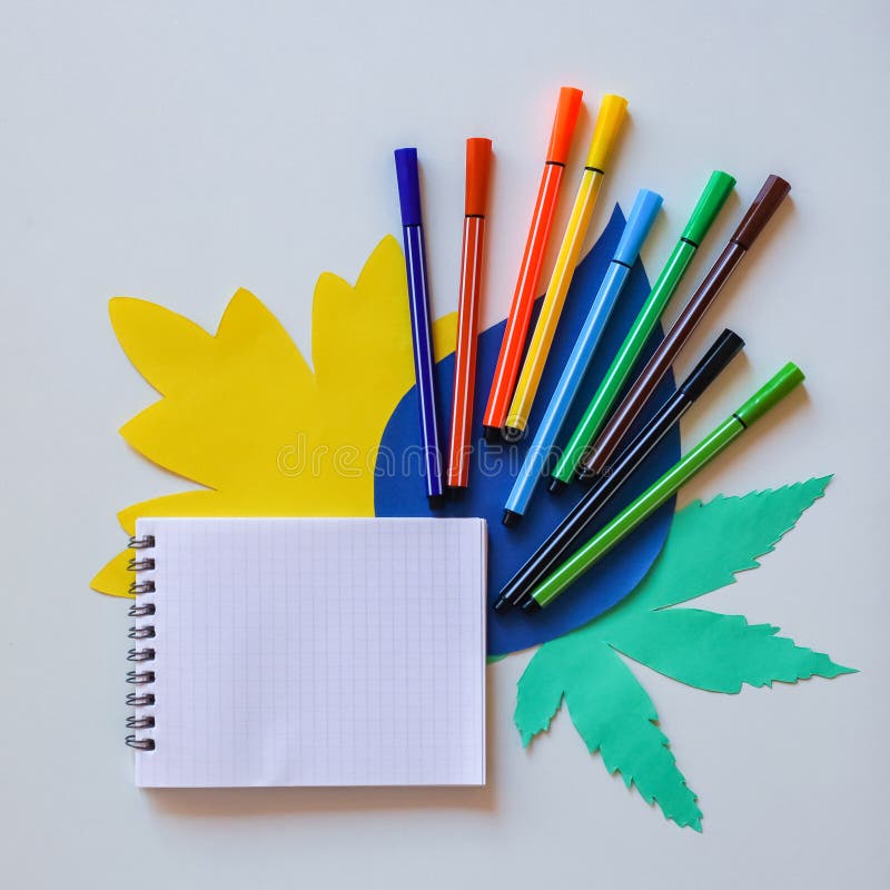 Multi Colored Markers and Notepad are on a White Surface Stock Photo ...