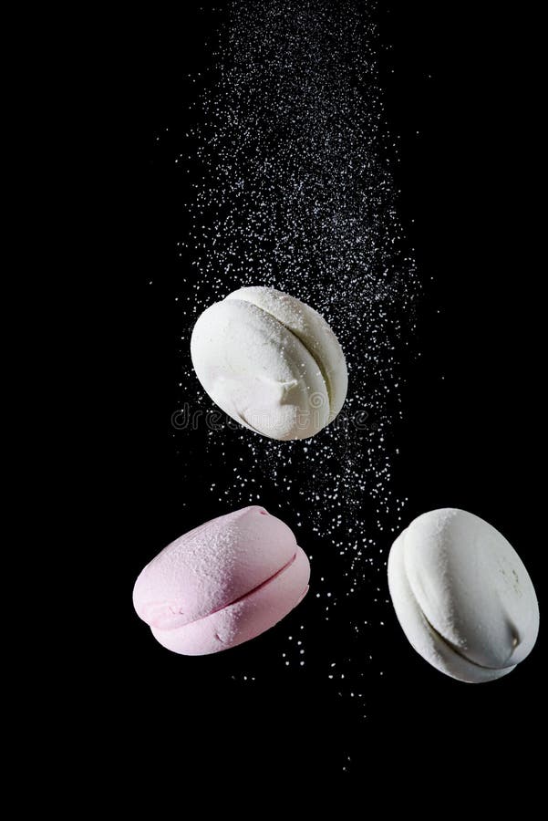 Multi-colored Marshmallows Stand in a Stack on a Black Background ...