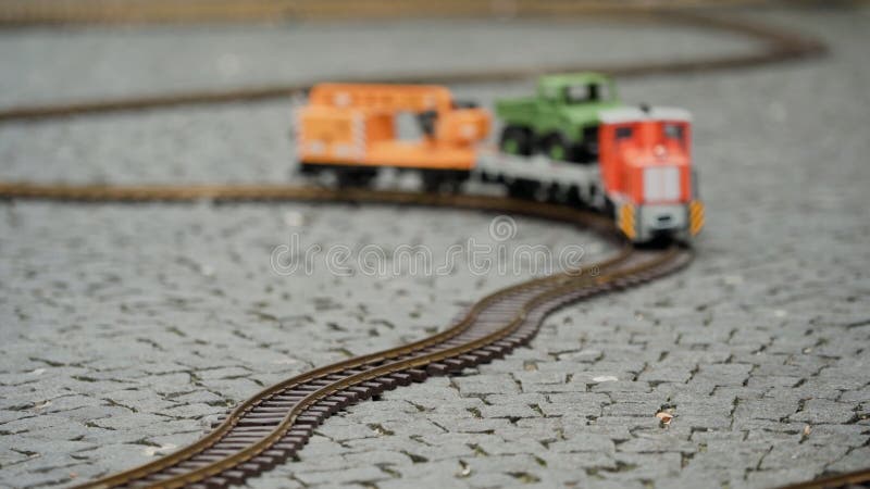 Multi Colored Model of Freight Train Travels Along the Winding Rails of ...