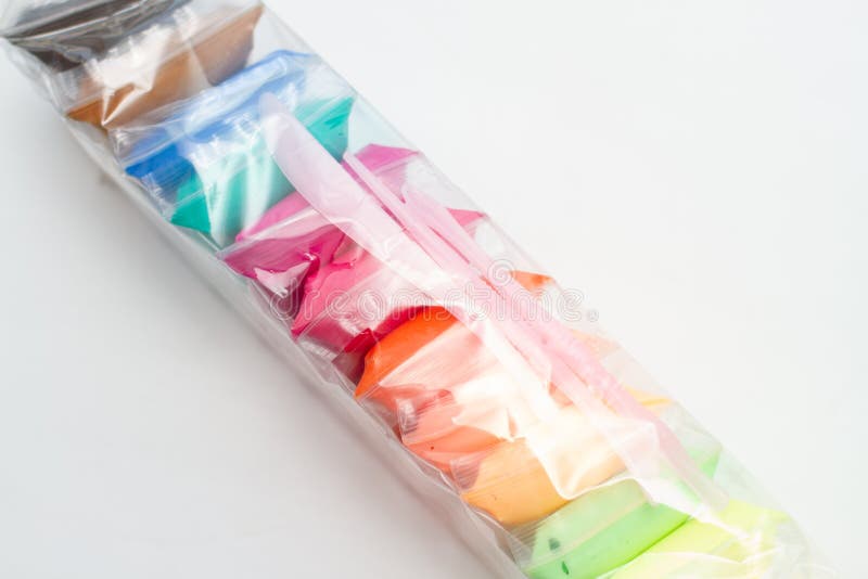 Multi-colored New Plasticine in Plastic Packaging. Rainbow Colors ...