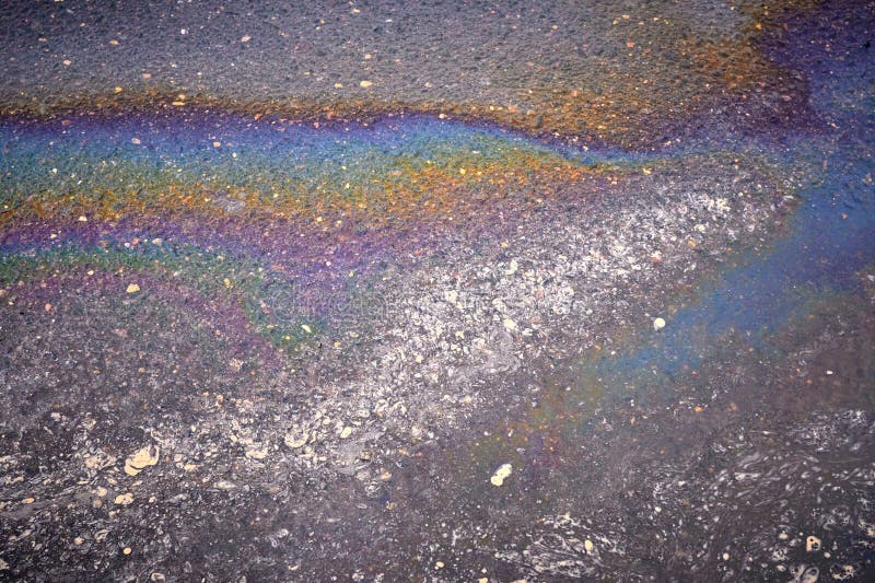 Multi Colored Oil Spill on Asphalt Road, Abstract Background. Oil Slick ...