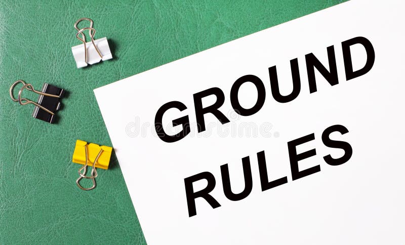 Multi-colored Paper Clips and a Sheet of Paper with the Text GROUND ...