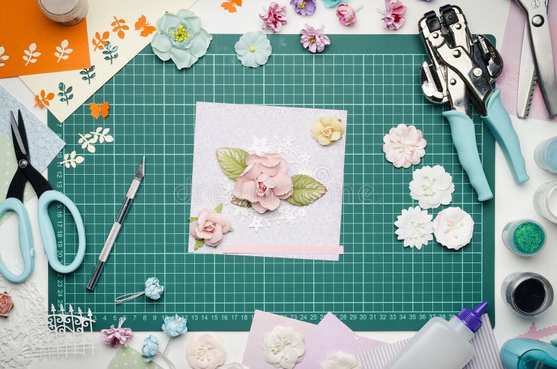 Multi-colored Paper Crafts on the Cutting Mat and Scrapbooking Tools ...