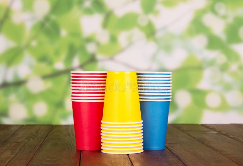 Multi-colored Paper Cups on Abstract Green. Stock Image - Image of ...