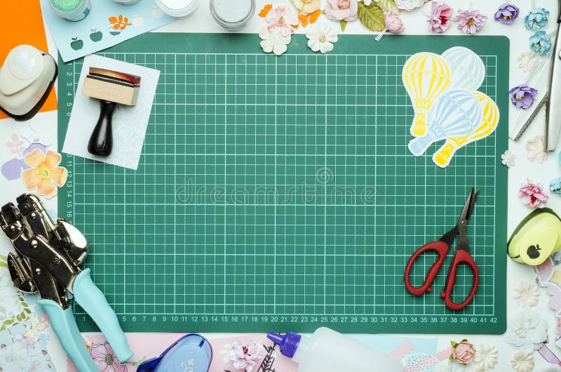 Multi-colored Paper, Scrapbooking Tools and Materials on Green Mat for ...