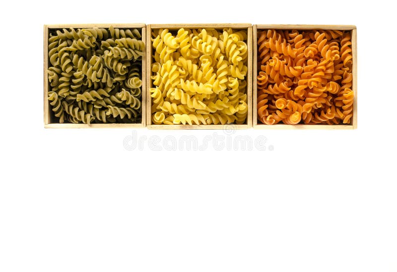 Multi-colored Pasta in the Form of Spirals Lie in Wooden Boxes that ...