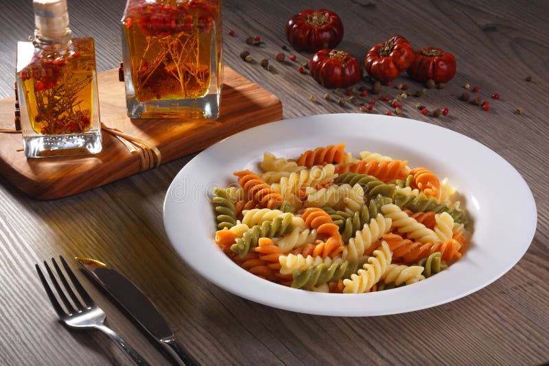 Multi Colored Pasta with Vegetable Stock Photo - Image of board ...