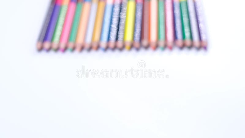 Multi-colored Pencils Stacked in a Row Close-up on a White Background ...